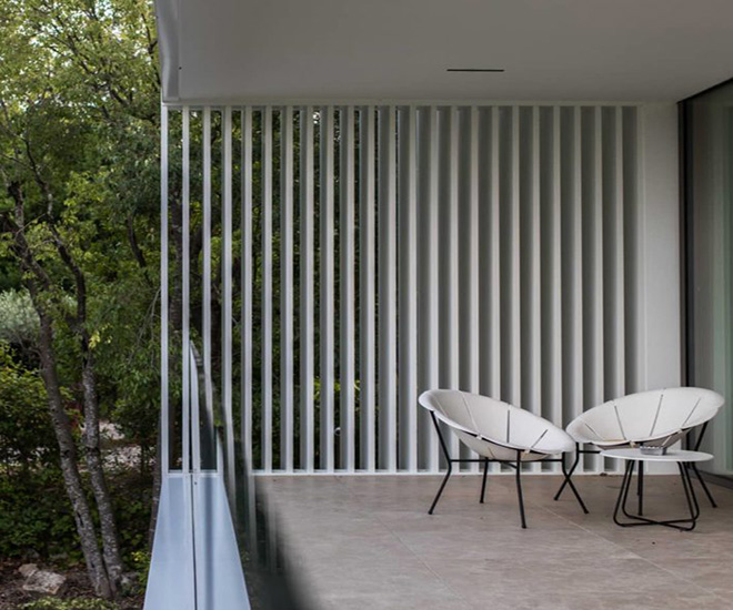 The CML House Expansion Results in a Bali Stone-Clad Mirror Pool